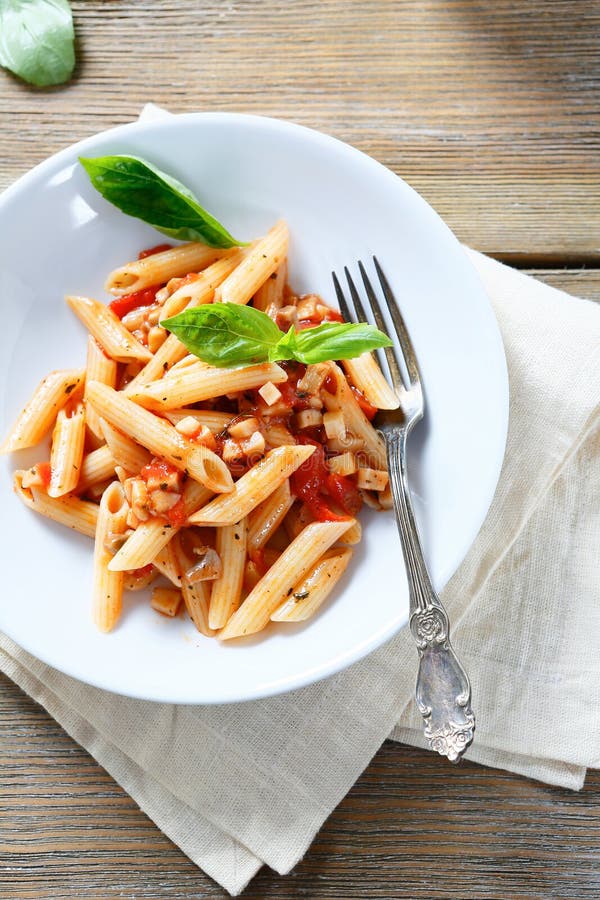 Penne pasta in a bowl stock image. Image of basil, mushrooms - 52515851
