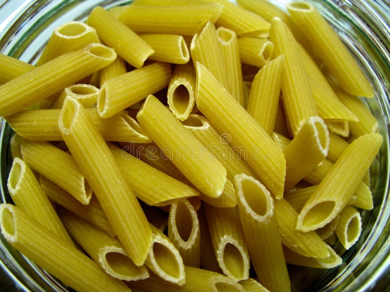 Penne Pasta in a Glass Jar stock photo. Image of yellow - 5076846