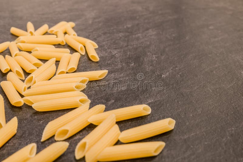 Penne Rigate Macaroni Pasta on Grey Working Surface Stock Image - Image ...