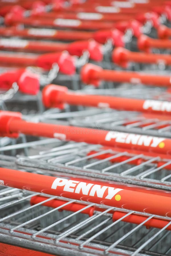 Penny shopping carts editorial stock photo. Image of logo - 69585173