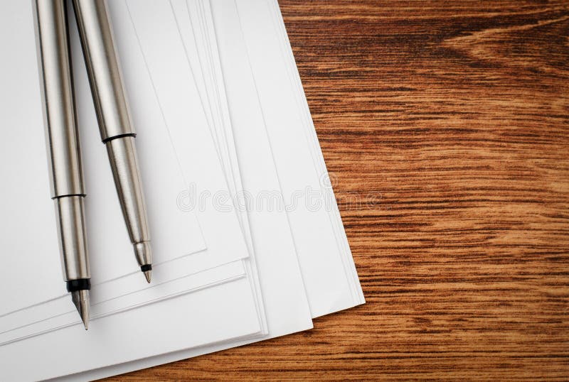 Pens and Sheets on Wooden Table with Copy Space Stock Image - Image of ...