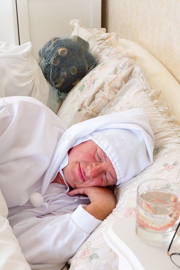Retired couple in bed stock image. Image of adult, pensioner - 27029029