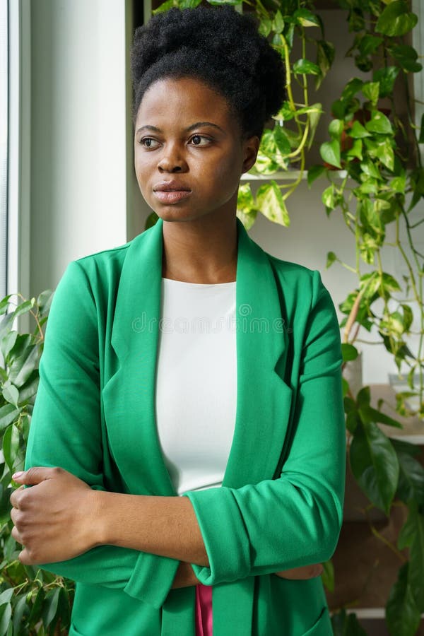 Pensive African Businesswoman Looking Out of Window, Lost in Thoughts ... Pensive African Businesswoman Looking Out of Window, Lost in Thoughts ...