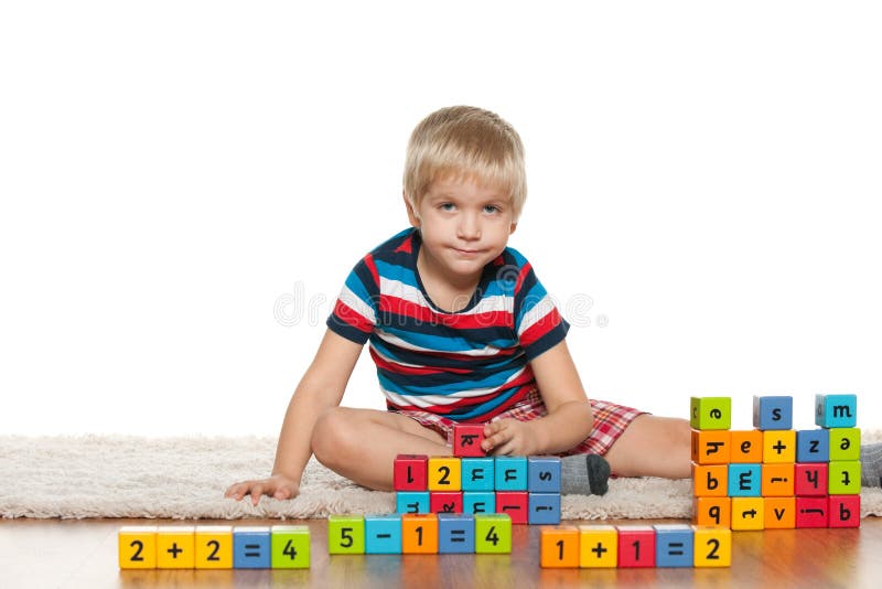 Pensive Boy with Blocks on the Floor Stock Photo - Image of ...