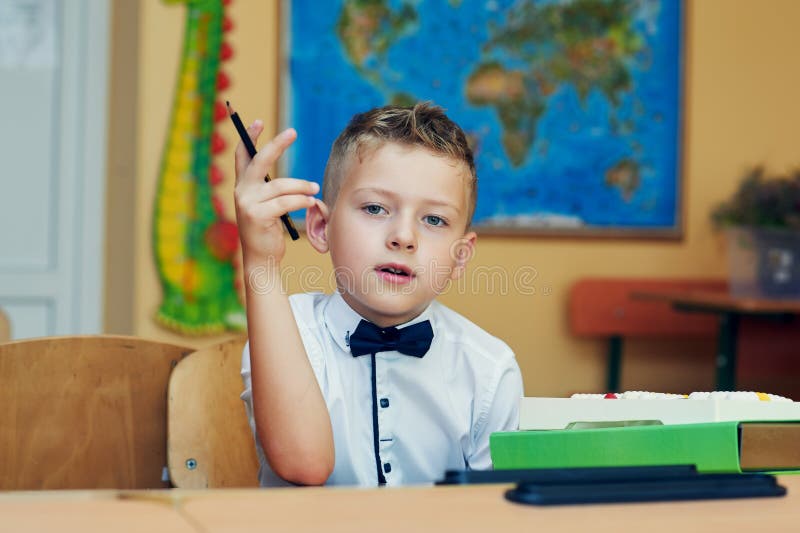 Pensive Boy in Class in Elementary School . the Child in the Classroom ...
