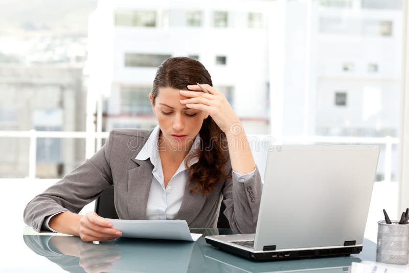 Pensive Businesswoman Looking at a Paper Stock Image - Image of ...