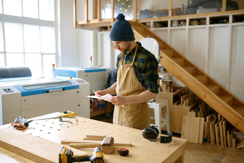 Pensive Carpenter Designer Looking at Plan Scheme on Work Table Stock ...