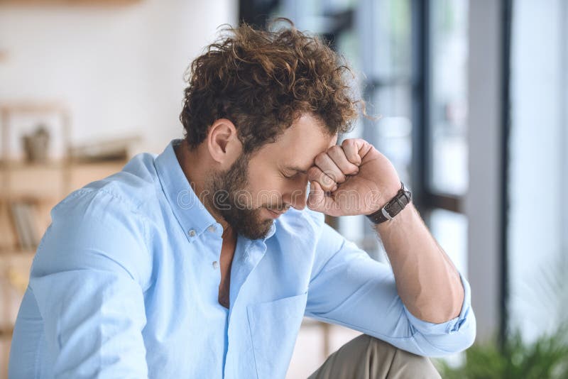 Pensive Caucasian Businessman with Eyes Closed in Office Stock Photo ...