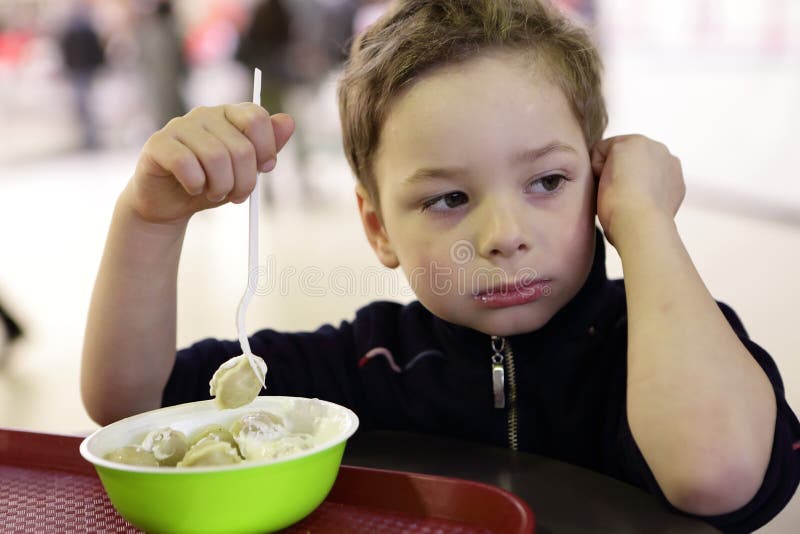 Pensive Child Eating Meat Dumplings Stock Image - Image of hand, diner ...
