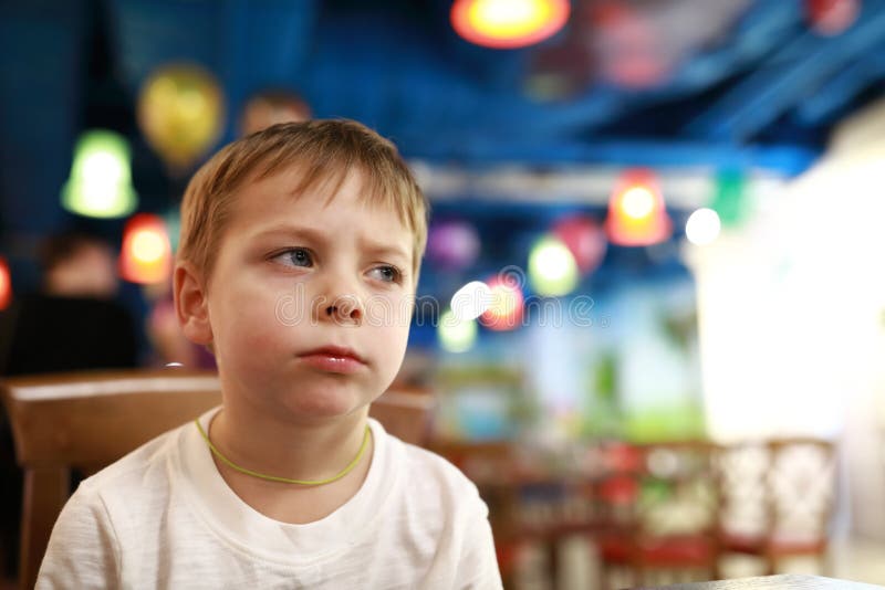 Pensive Child in Restaurant Stock Image - Image of dreaming, pensive ...