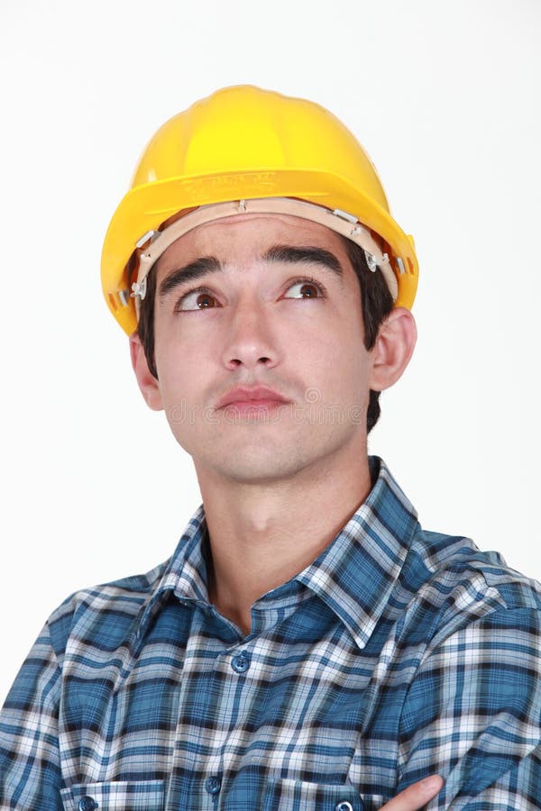 Confused Construction Worker Holding Spirit Level in New House Stock ...