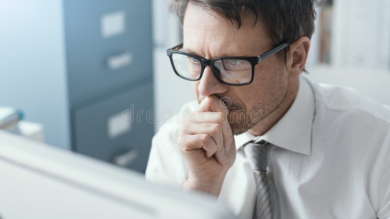 Pensive Corporate Executive Working with a Computer Stock Photo - Image ...