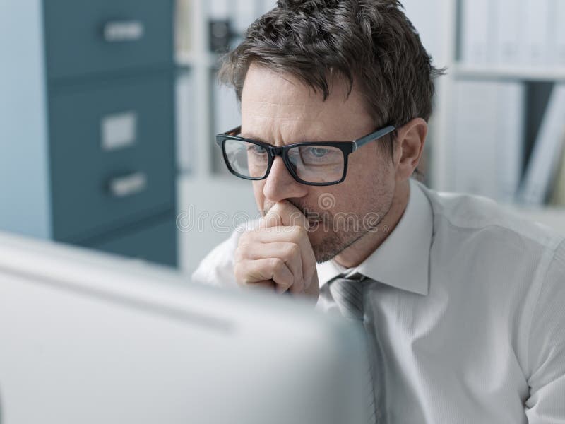 Pensive Corporate Executive Working with a Computer Stock Image - Image ...
