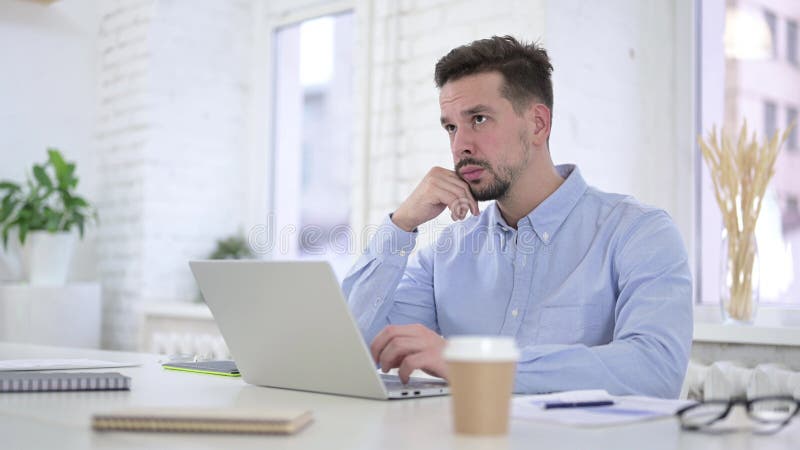 Pensive Creative Young Man Thinking at Work Stock Image - Image of ...