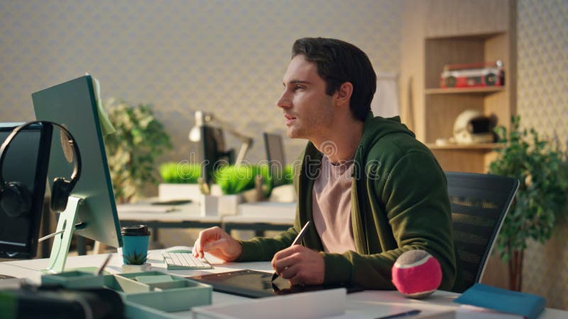 Pensive Creator Watching Computer Screen at Office. Freelance Man Using ...