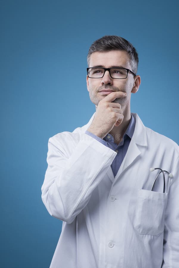 Pensive Doctor with Hand on Chin Stock Image - Image of ambitious ...