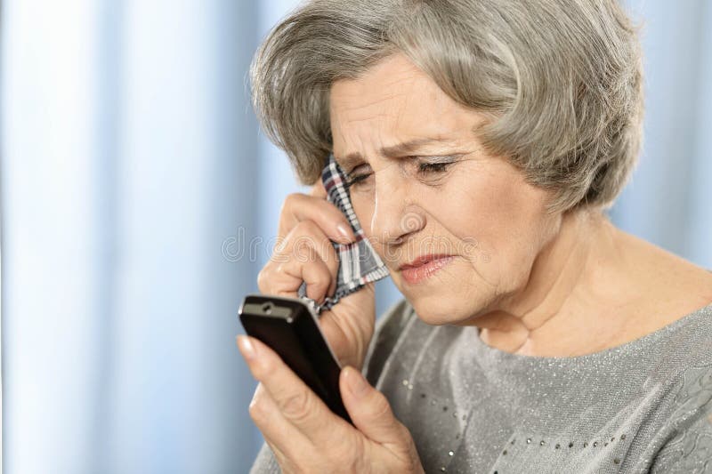 Pensive elderly woman stock image. Image of phone, concern - 67824829