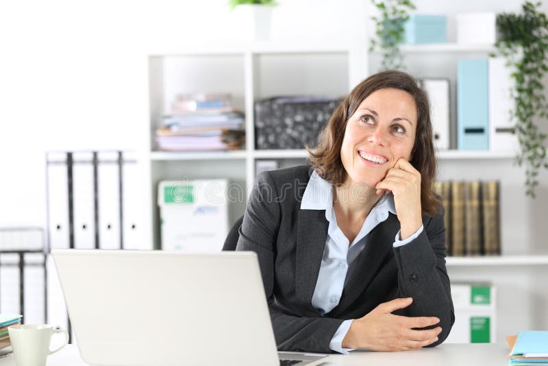 Pensive Executive Lady Thinking Looking Up at Office Stock Image ...