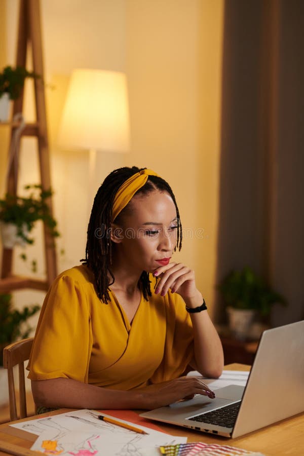 Designer Looking for Reference Stock Image - Image of pensive ...