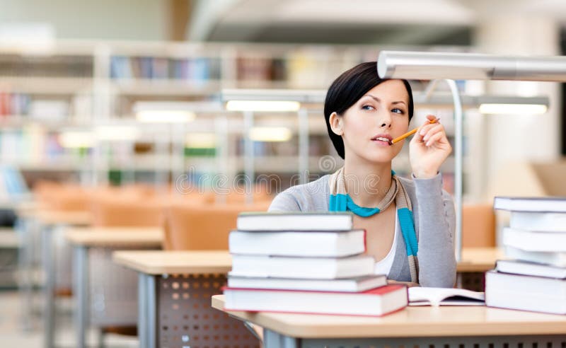 Pensive Female Student Studies at the Reading Hall Stock Photo - Image ...