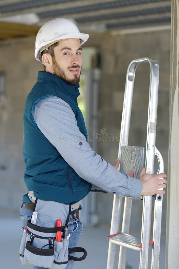 Pensive Handsome Construction Worker on Ladder Stock Image - Image of ...