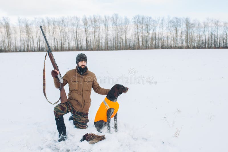 Pensive Hunter Holding a Gun and Resting after Difficult Hunting. Stock ...