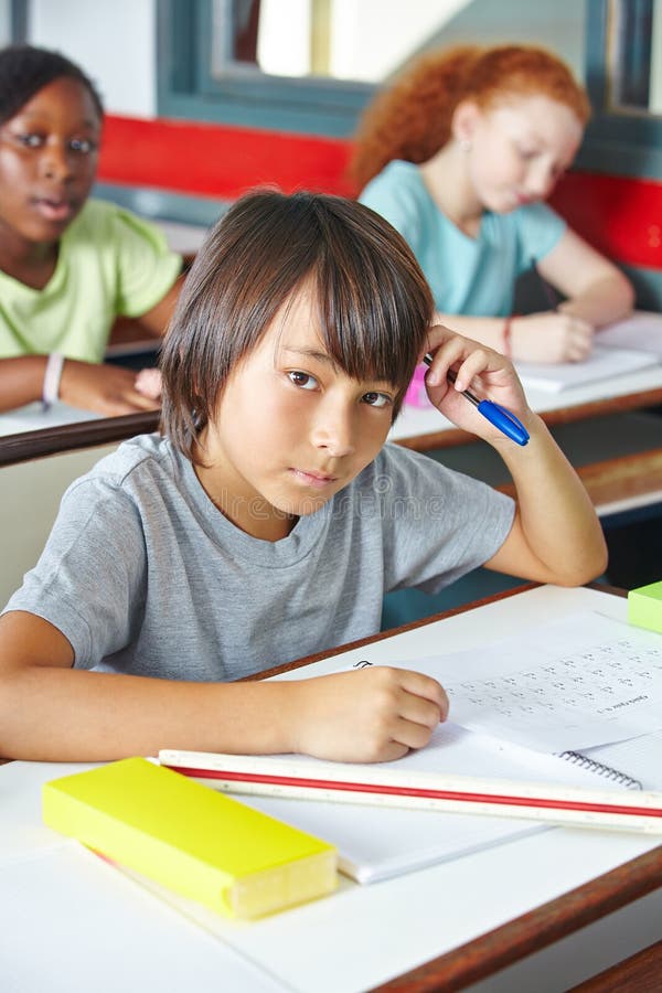 Pensive Japanese Child In Class Stock Image - Image of interracial ...