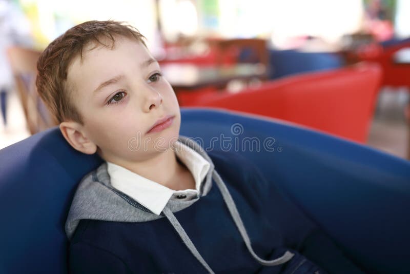 Pensive kid in cafe stock photo. Image of horizontal - 118092634