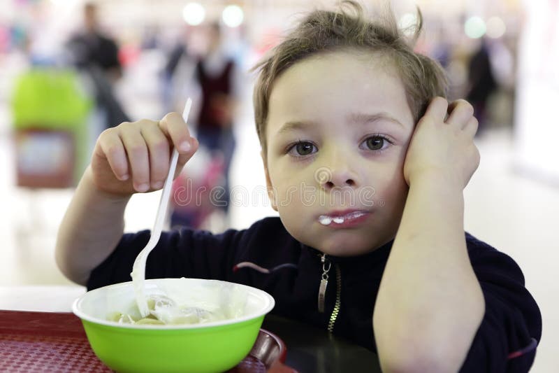 Boy Eating Meat Dumplings with Sour Cream Stock Photo - Image of meal ...