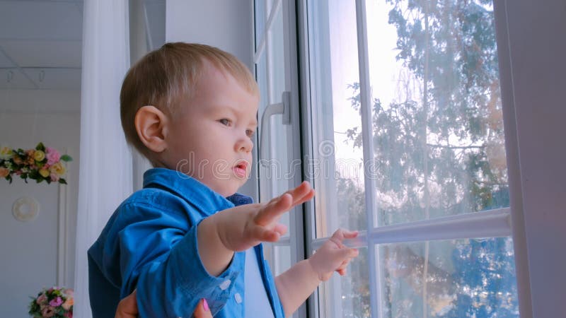 Pensive Little Boy Looking through Window Stock Image - Image of cute ...