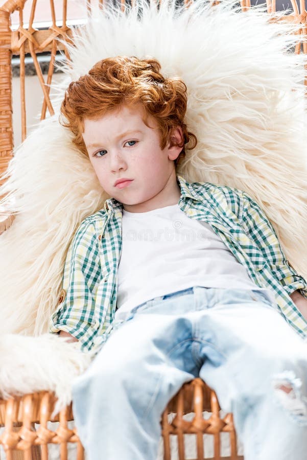 Pensive Little Boy Sitting on Chair with Wool Stock Photo - Image of ...