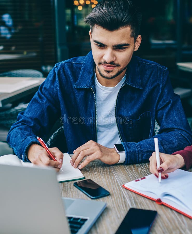 Pensive Male and Female Students Watching Tutorial on Laptop Computer ...