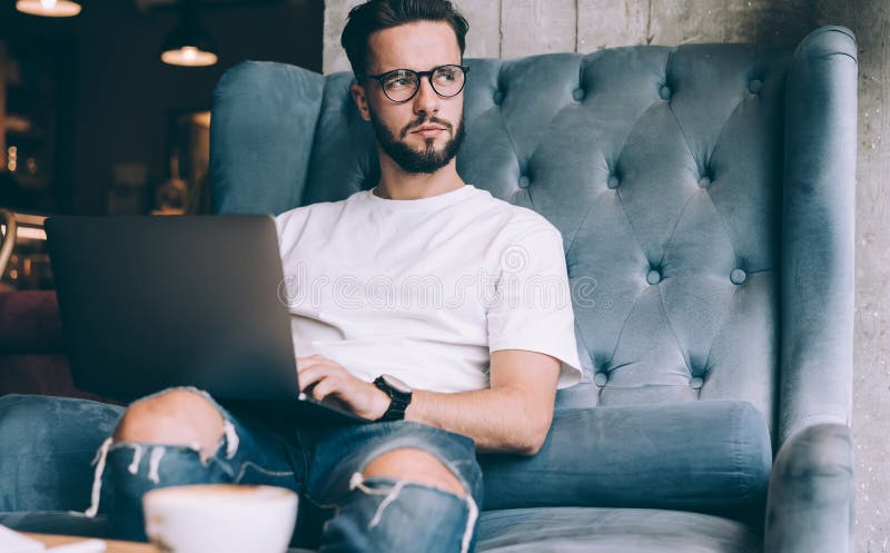 Skilled Blogger Man with Netbook Thinking Indoors Stock Photo - Image ...