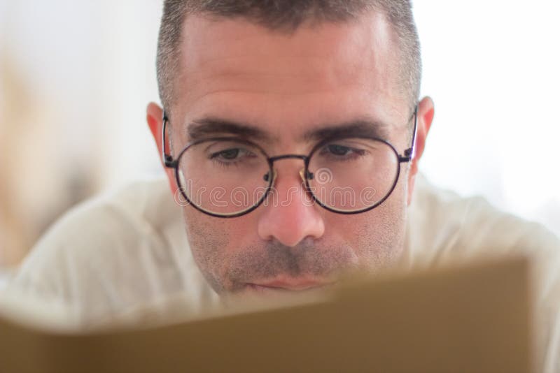 Pensive Man Lying and Reading Book in Morning Stock Image - Image of ... Pensive Man Lying and Reading Book in Morning Stock Image - Image of ...