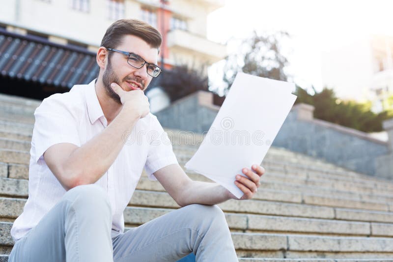 Pensive Man Reading the Documents Outdoors Stock Image - Image of ...