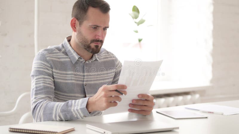 The Pensive Man Reading Documents at Work Stock Photo - Image of ...