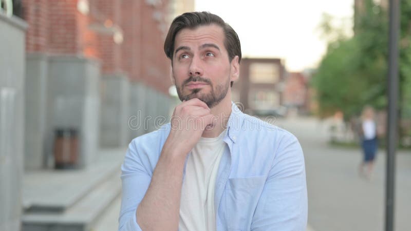 Pensive Man Thinking while Standing Outdoor Stock Photo - Image of ...