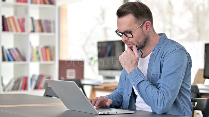 Pensive Young Man Thinking at Work, Brainstorming Stock Image - Image ...