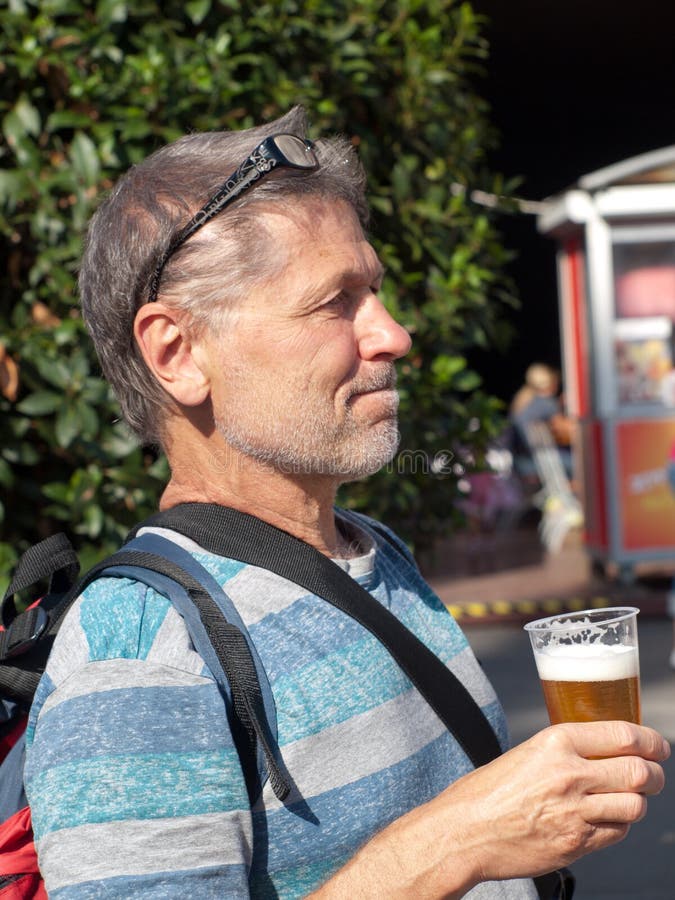 Pensive old man with beer stock photo. Image of tranquility - 33067706