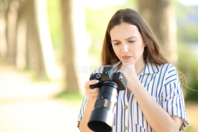 Pensive Photographer Checking Work on Camera Stock Image - Image of ...