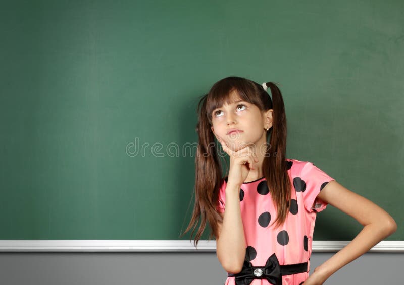 Pensive Schoolgirl Reading Article Stock Photo - Image of student ...