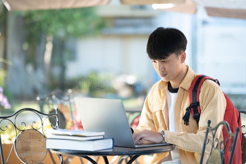 Pensive Student with Laptop Outdoors on University Grounds Stock Photo ...