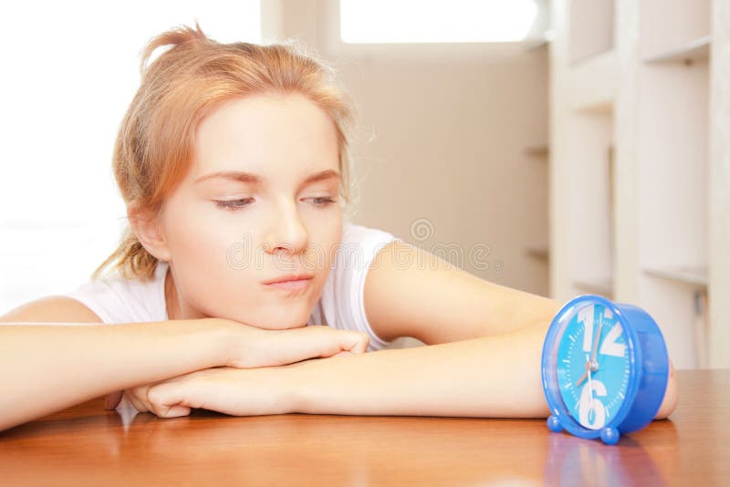 Pensive Teenage Girl with Clock Stock Photo - Image of adolescence ...