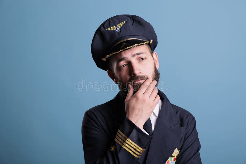 Pensive Thoughtful Airline Capitan in Uniform Questioning Stock Photo ...