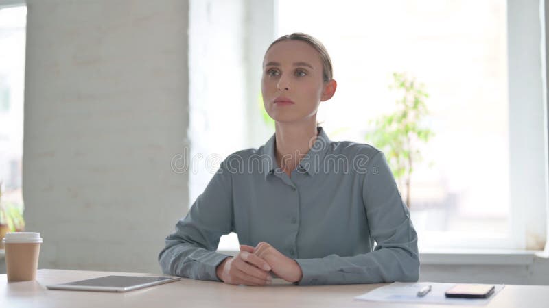 Pensive Woman Thinking while Sitting in Office Stock Photo - Image of ...