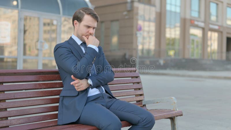 Pensive Businessman Thinking while Sitting Outdoor on Bench Stock Photo ...