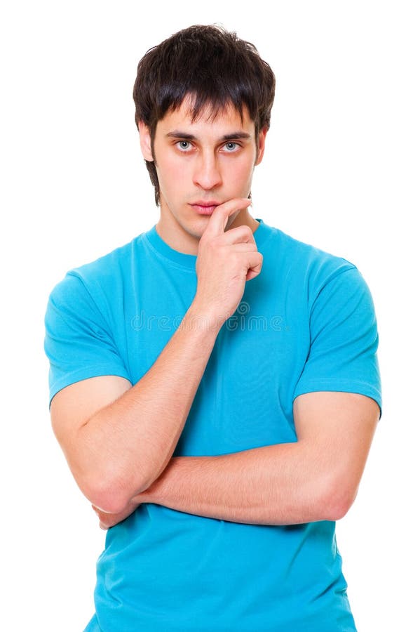 Pensive Young Man Is Posing Against White Wall Stock Photo - Image of ...