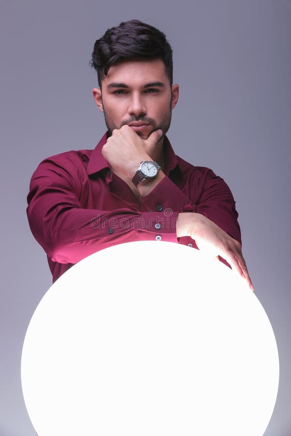 Pensive Young Man and a Ball of Light Stock Photo - Image of young ...