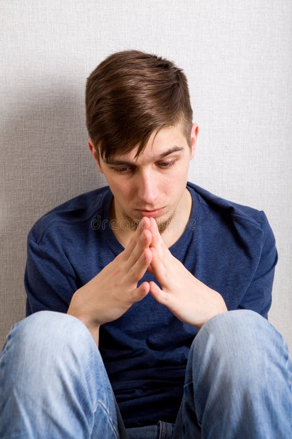 Pensive Young Man stock photo. Image of domestic, cute - 158760140