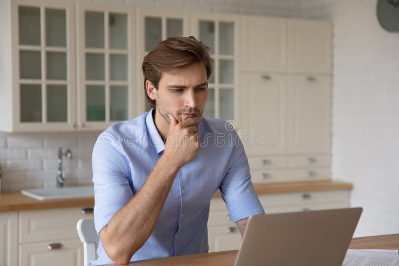 Pensive Young Man Look at Laptop Screen Thinking Stock Image - Image of ...